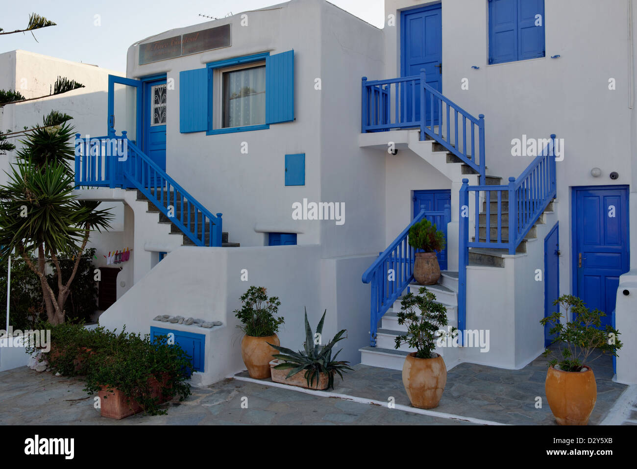Mykonos. Cyclades. Grecce. White-washed house with a blue doors and ...