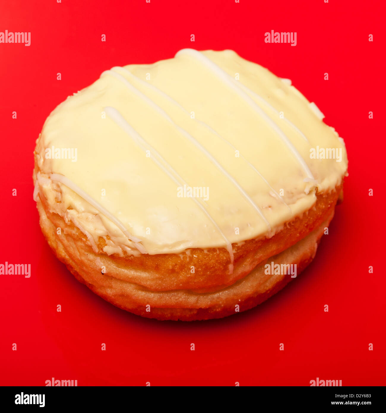 Iced Donut on a red studio background Stock Photo - Alamy