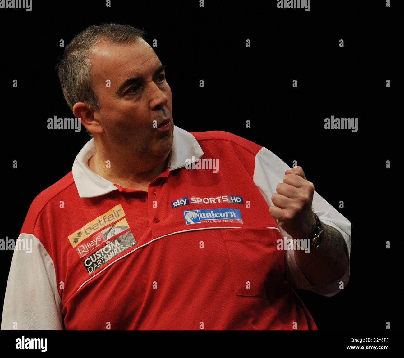 England's 16 time world champion Phil Taylor throws a dart during the ...
