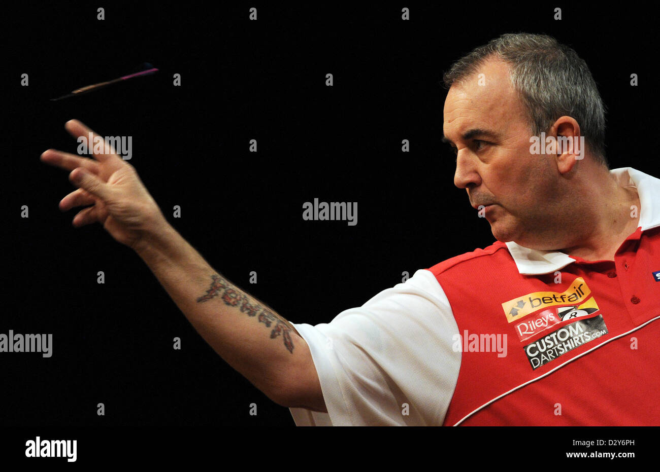 England's 16 time world champion Phil Taylor throws a dart during the ...