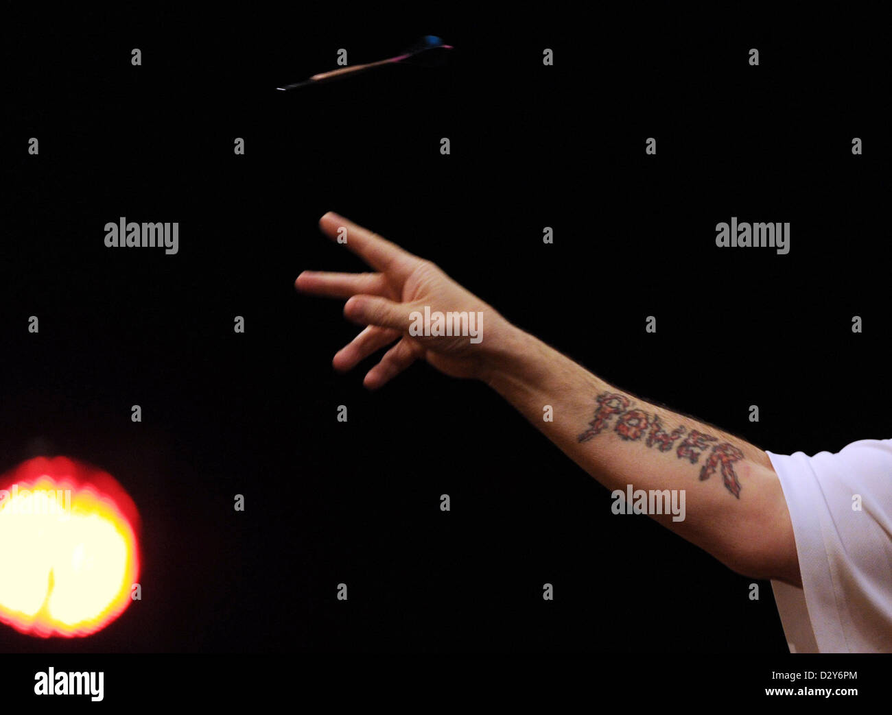 England's 16 time world champion Phil Taylor throws a dart during the ...