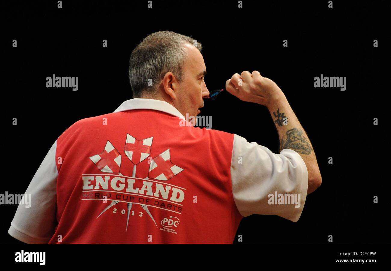 England's 16 time world champion Phil Taylor throws a dart during the ...