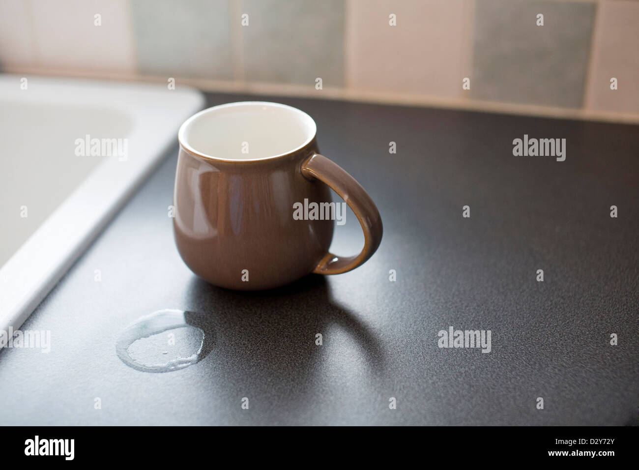 single coffee mug on worktop Stock Photo - Alamy