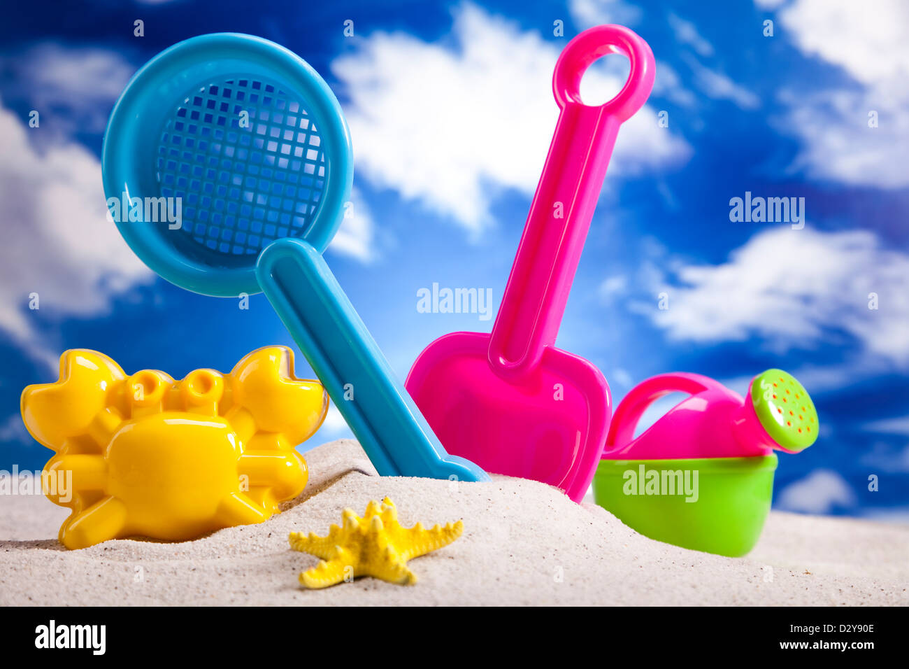 Colorful plastic toys on the beach Stock Photo - Alamy