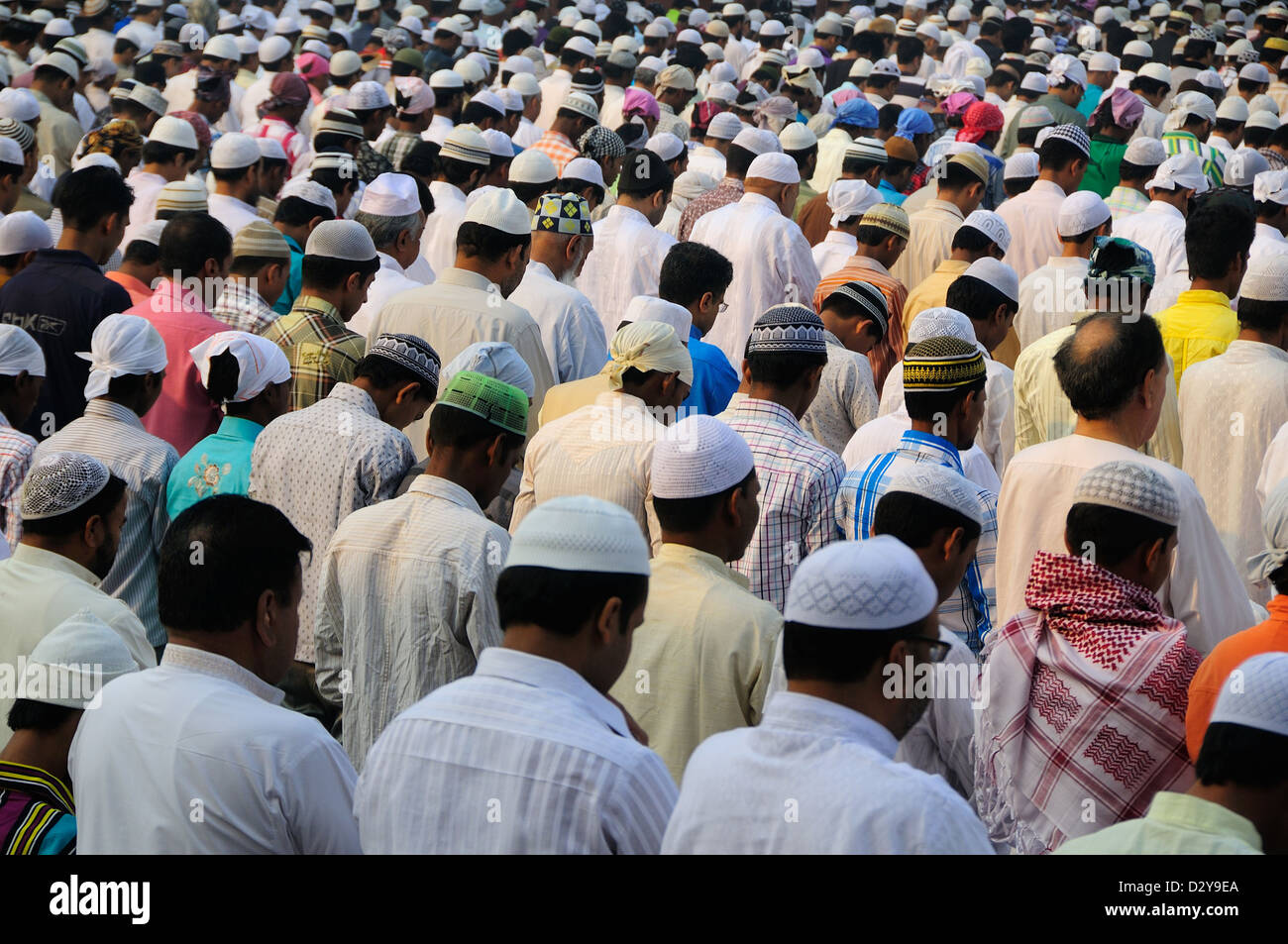 Thousands of Muslim people sitting inside and outside of the Mosque ...