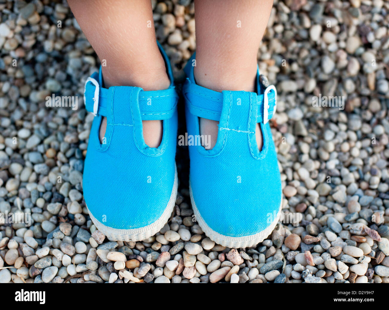 Children's feet in blue shoes Stock Photo - Alamy