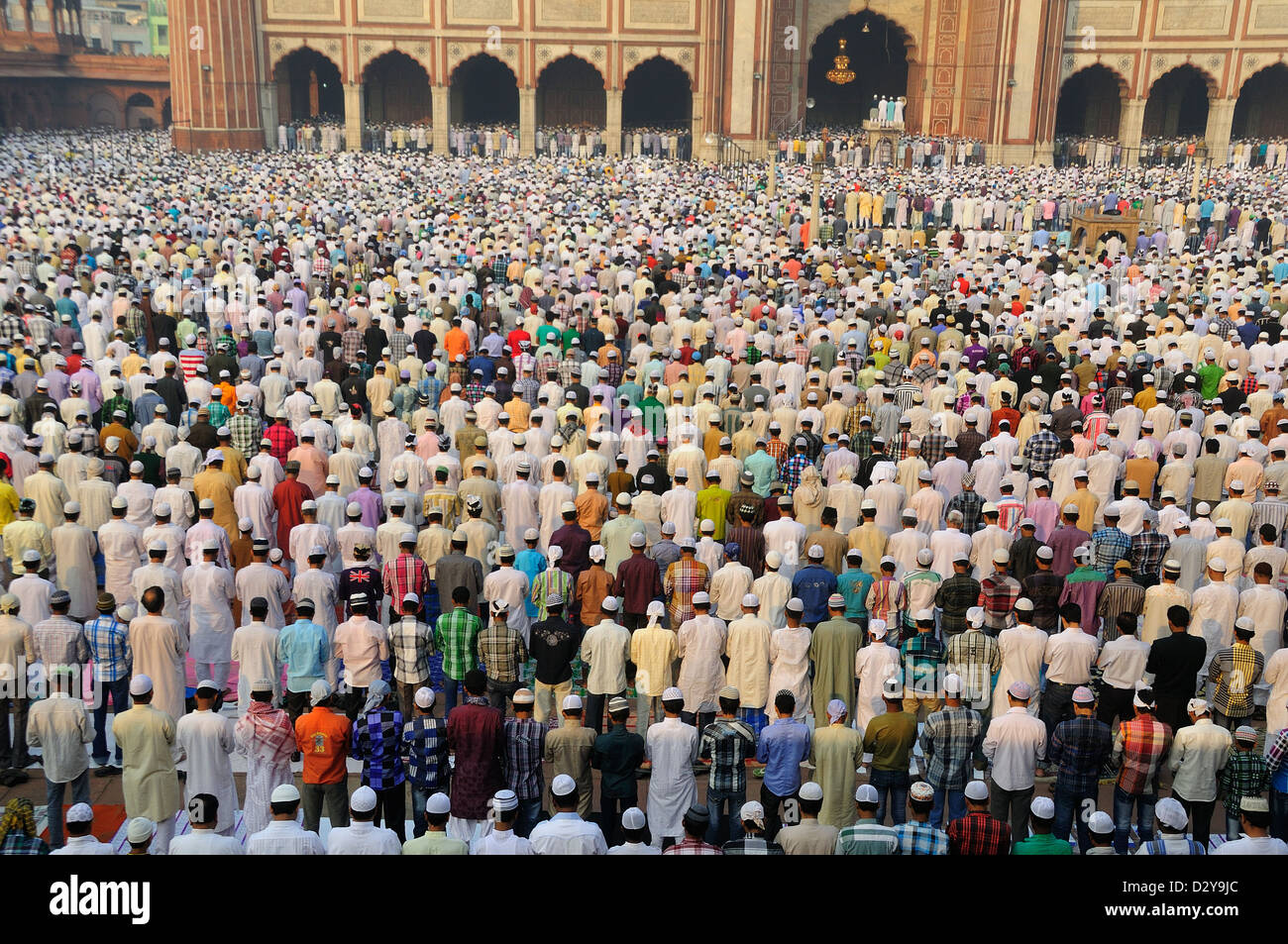 Thousands of Muslim people sitting inside and outside of the Mosque ...