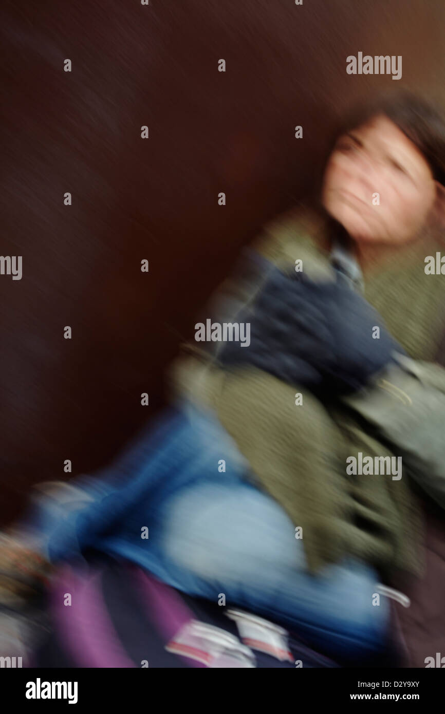 Homeless person in doorway, blurred imaged Stock Photo - Alamy