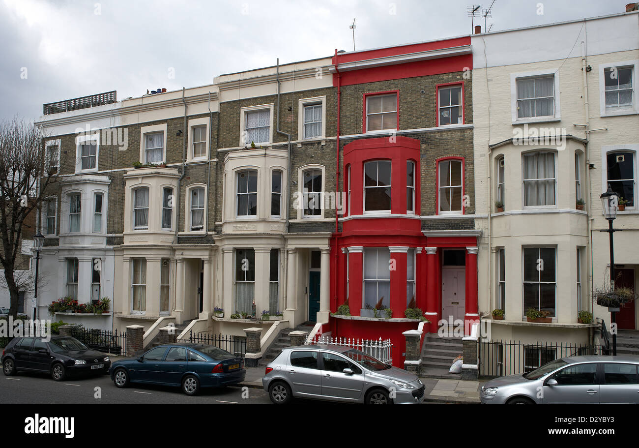 London, UK, colorful townhouses in the district of North Kensington ...