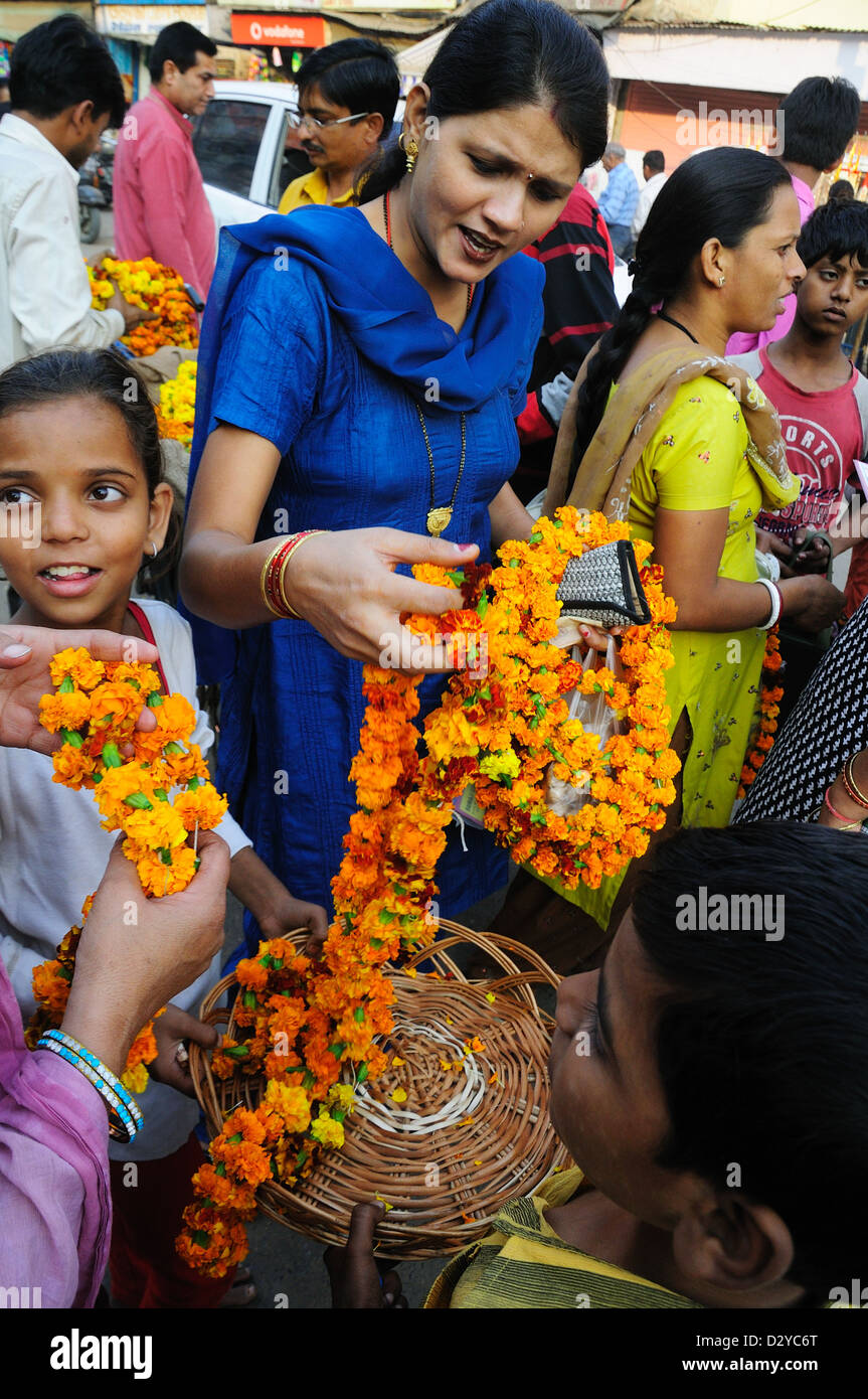 Little boy and girl selling flower on the street on the day of Diwali ...