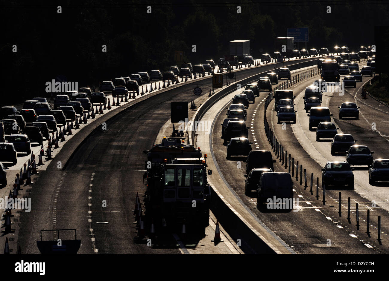 Cars queue and are delayed as traffic builds during maintenance on the ...