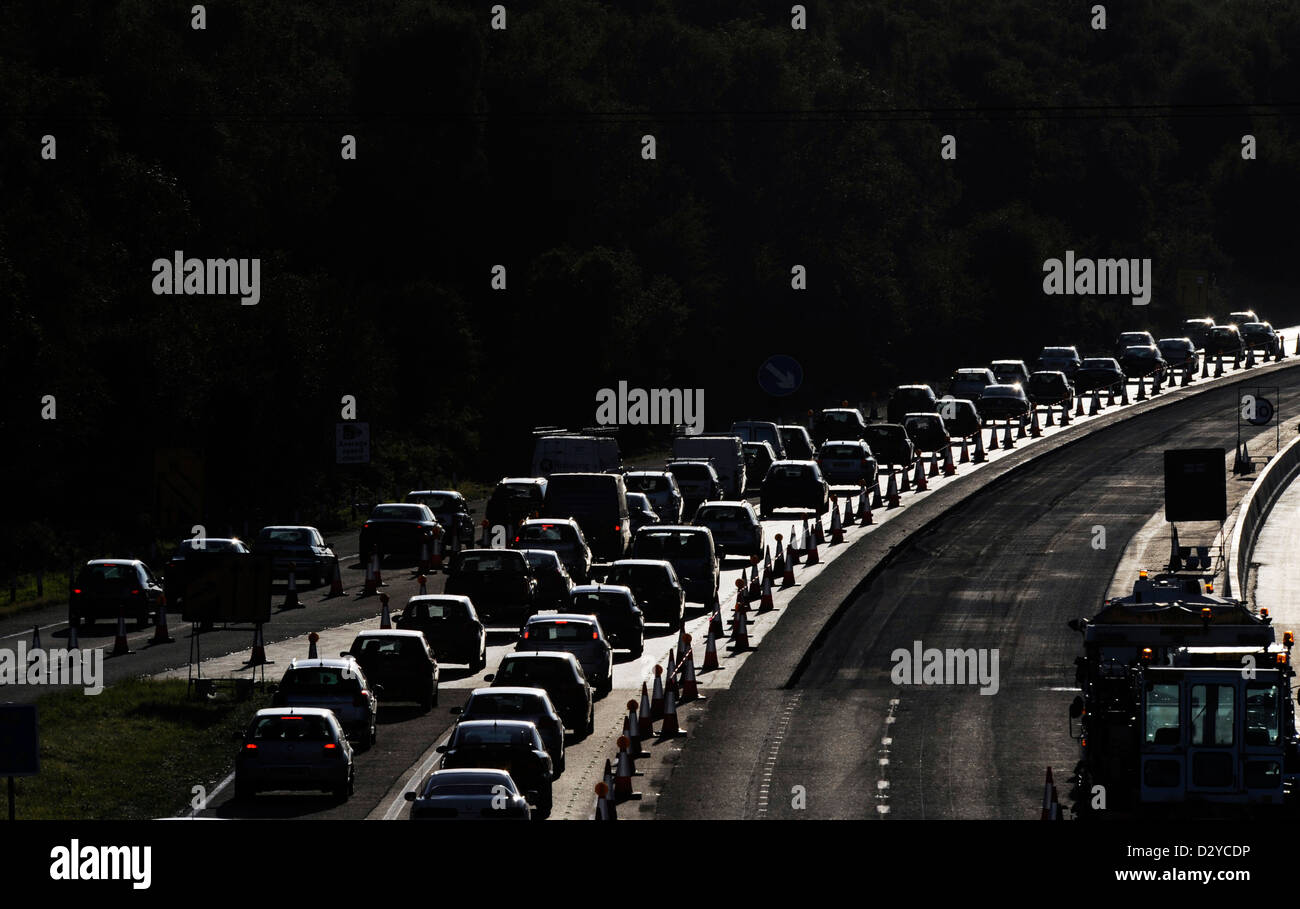 Cars queue and are delayed as traffic builds during maintenance on the ...