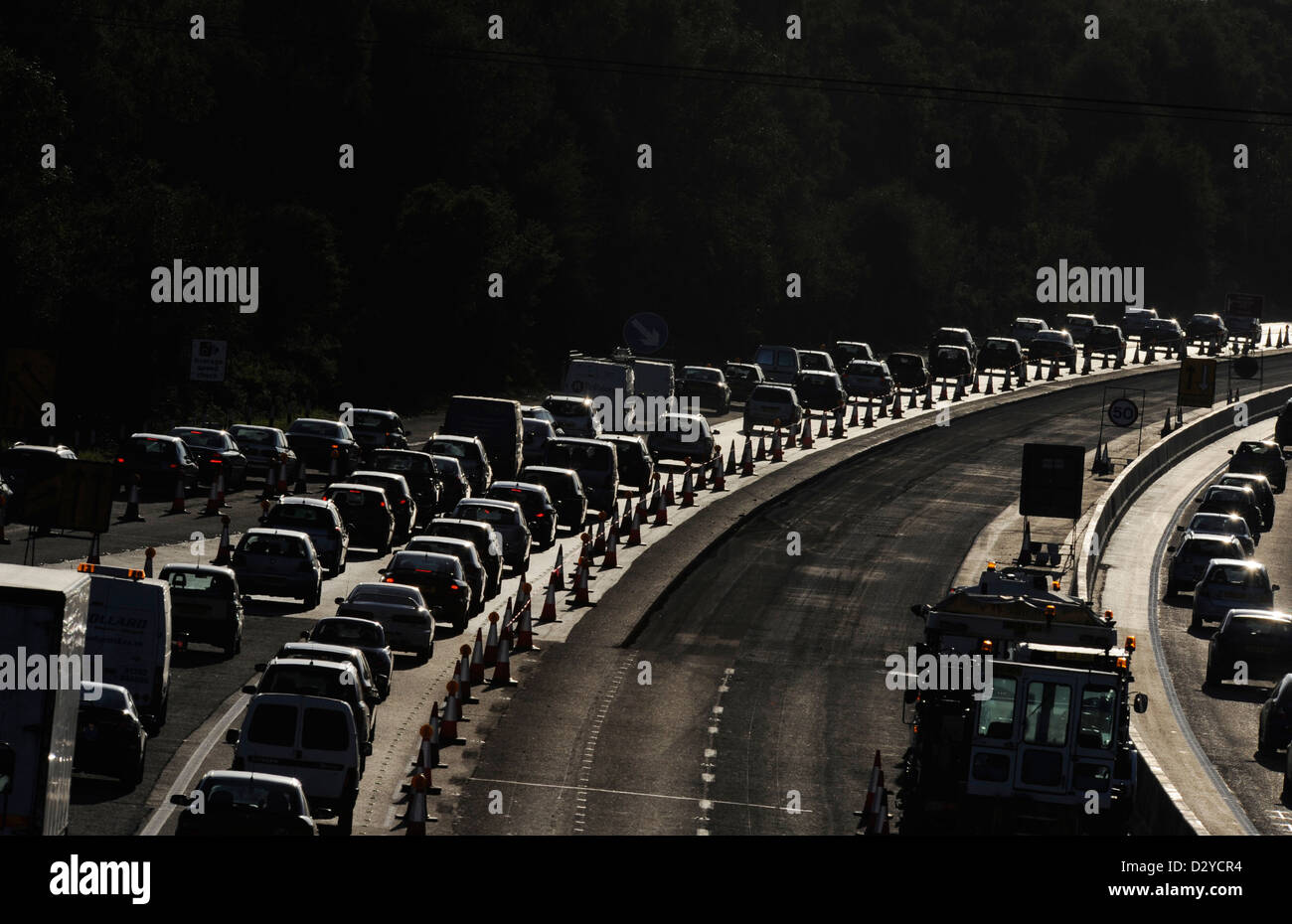 Cars queue and are delayed as traffic builds during maintenance on the ...