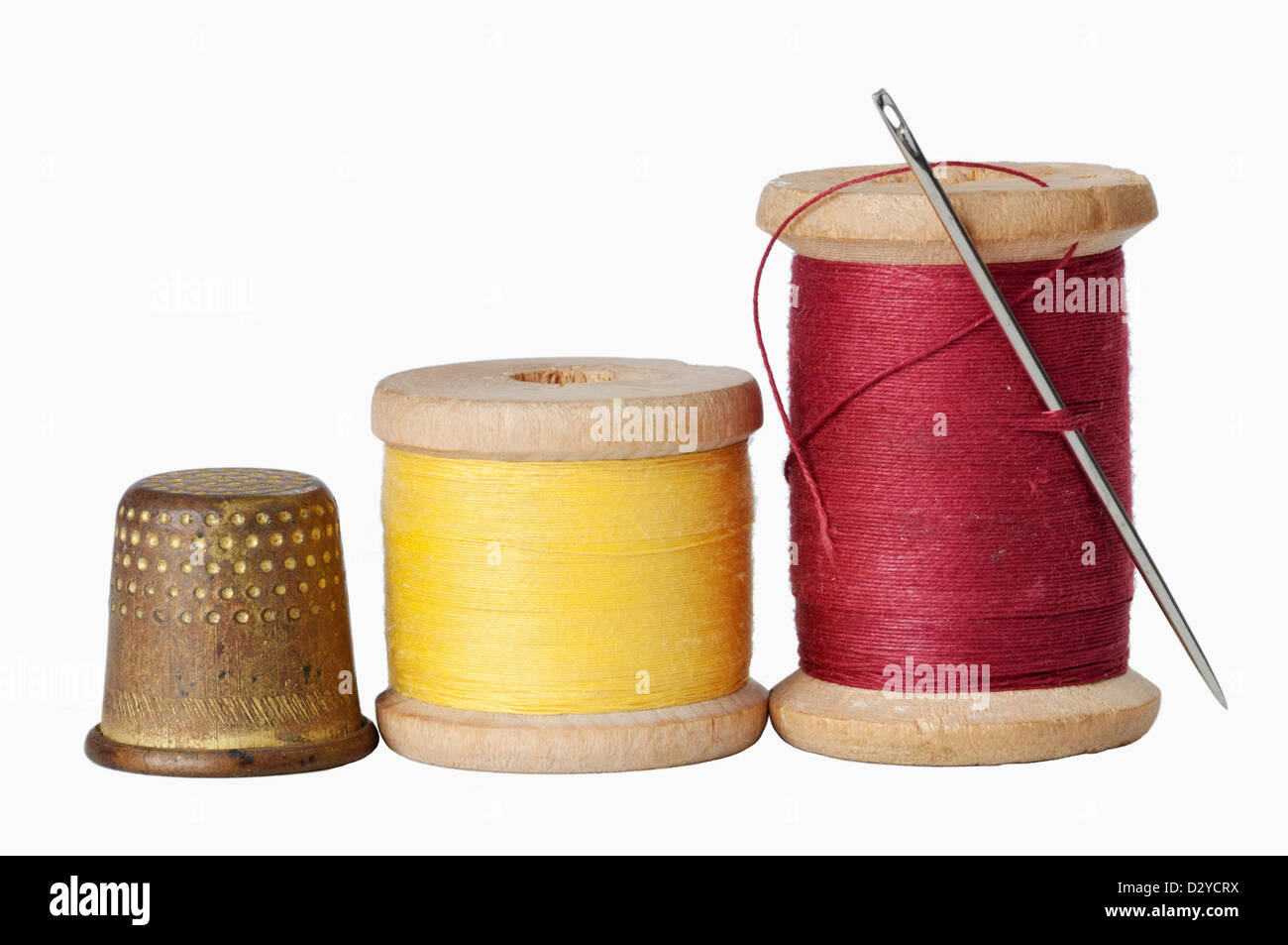 Old thimble and needle with thread isolated Stock Photo - Alamy