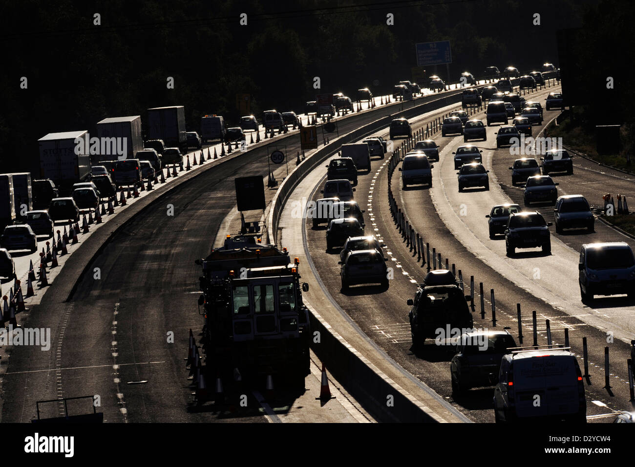 Cars queue and are delayed as traffic builds during maintenance on the ...
