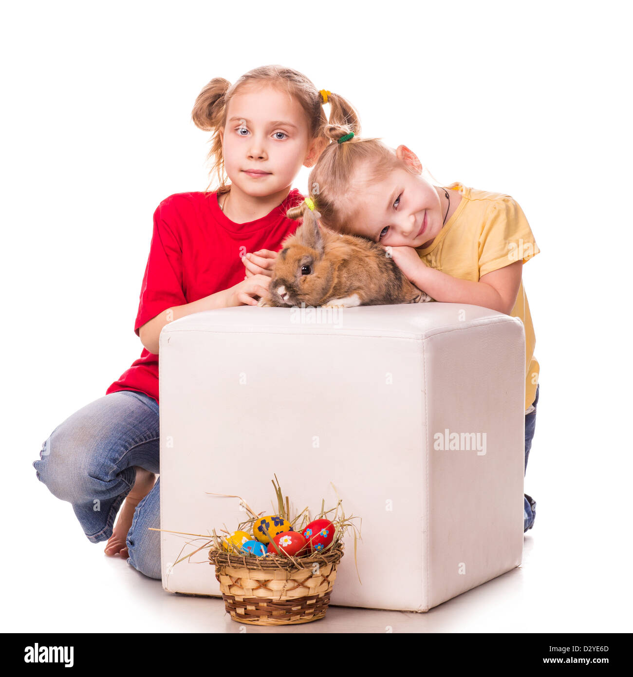 Two happy kids with easter bunny and eggs isolated on white. Happy ...