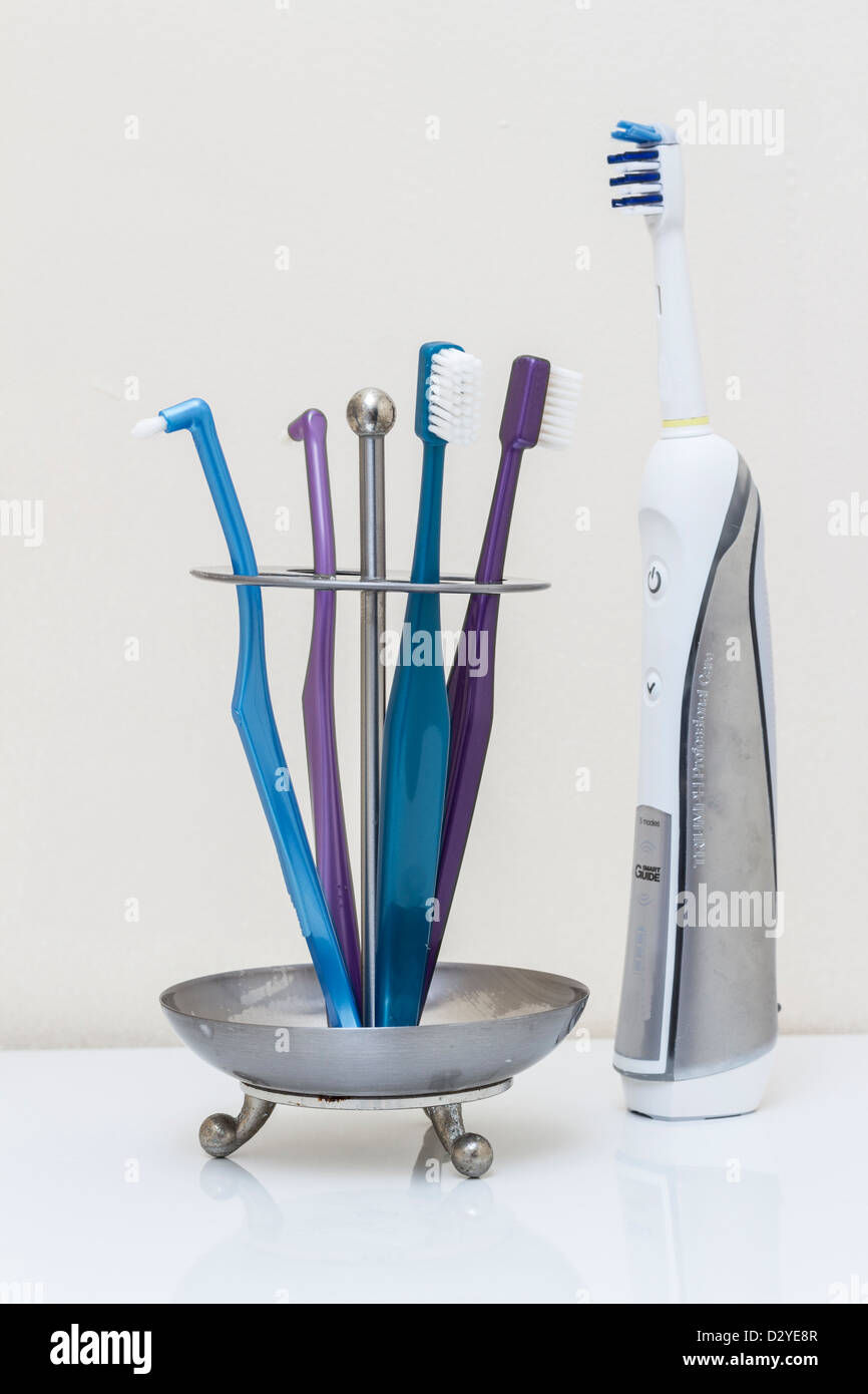 Toothbrushes in bathroom Stock Photo - Alamy
