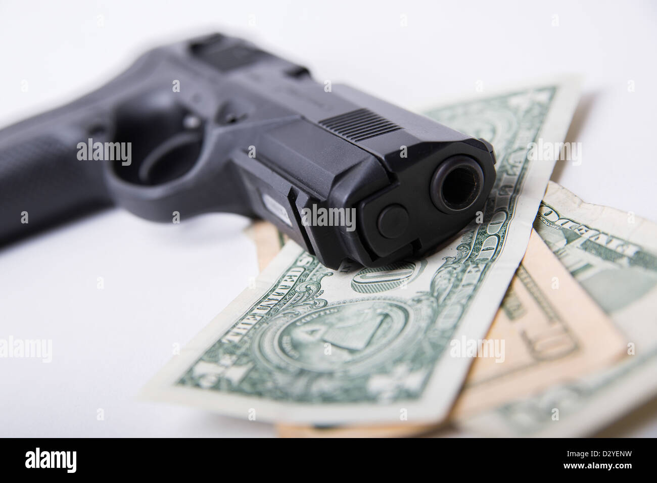 Guns and money Stock Photo - Alamy