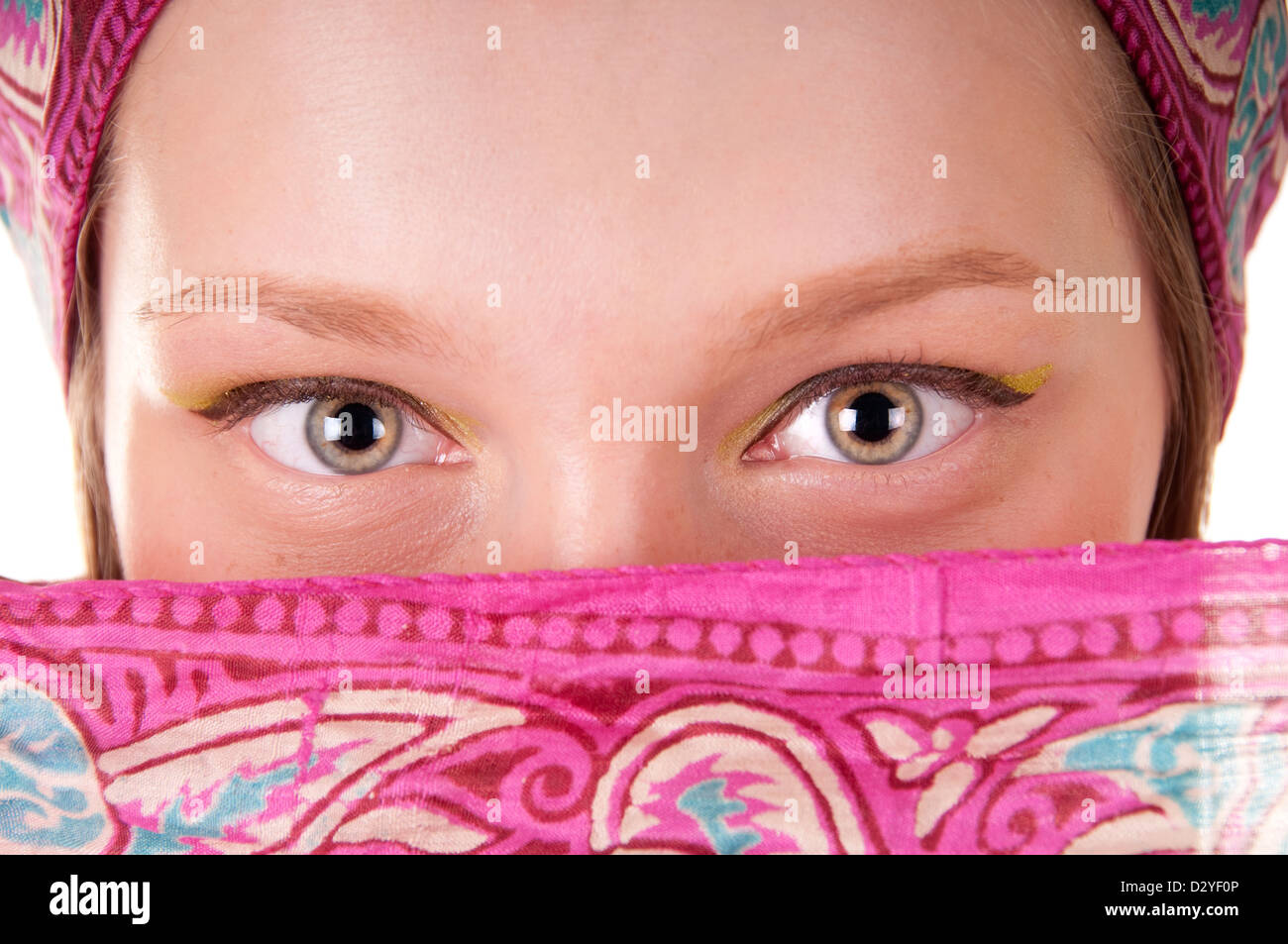 Young woman with covered face by scarf close-up Stock Photo - Alamy