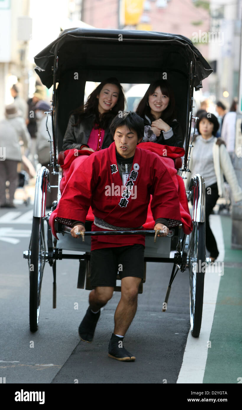 Kamakura, Japan, women are sitting in a rickshaw Stock Photo - Alamy