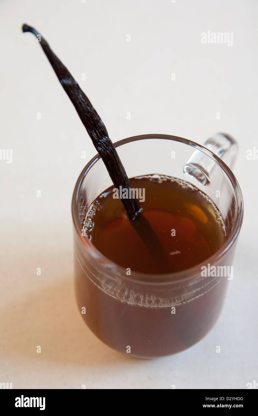 Close-up view of organic Vanilla Infusion in a cup with a Vanilla stick ...