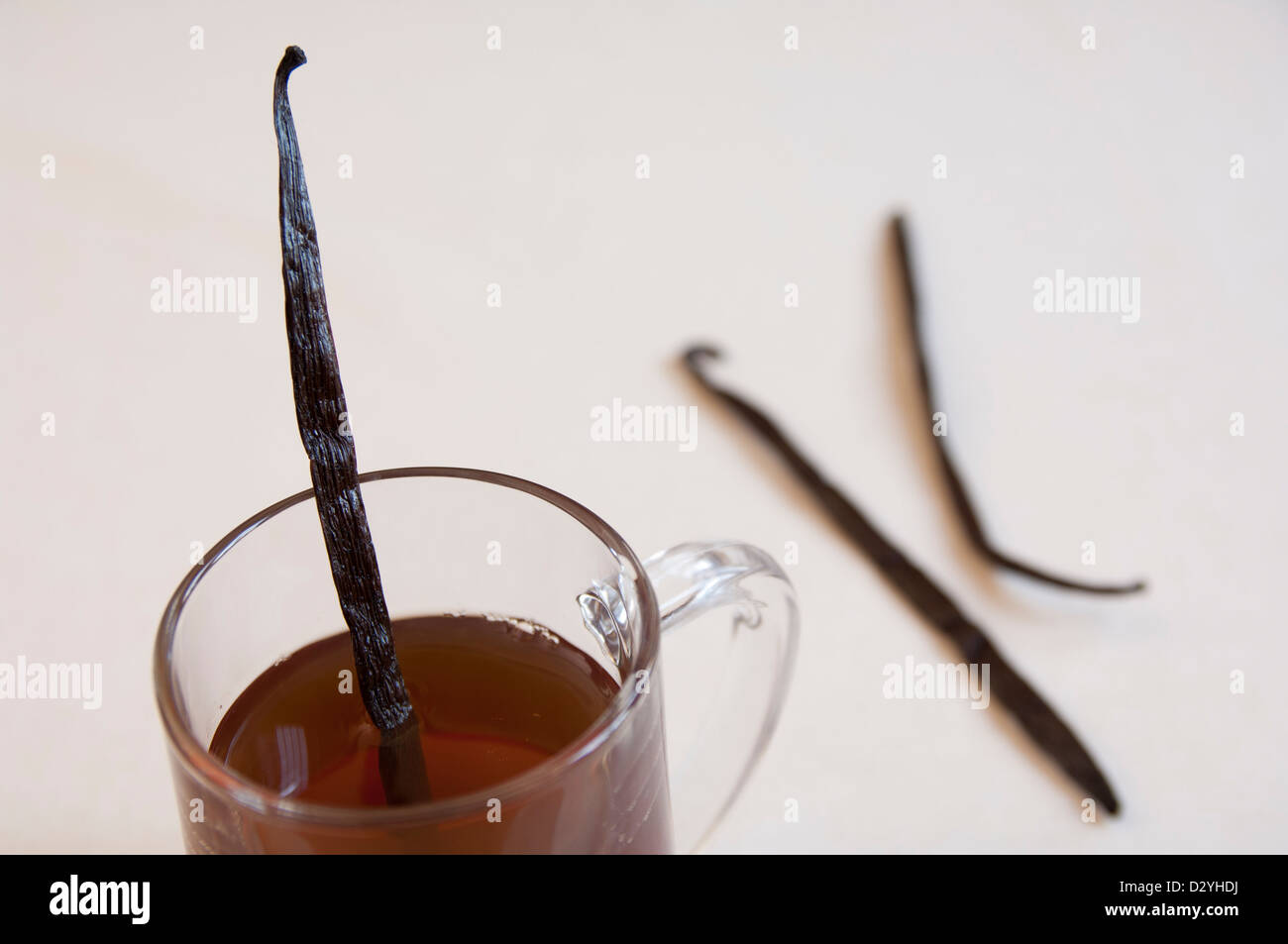 Close-up view of organic Vanilla Infusion in a cup with a Vanilla stick ...