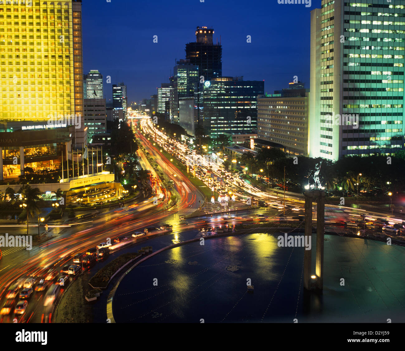 Indonesia, Java, Jakarta, evening view of Central Jakarta with Hotel Indonesia roundabout and ...