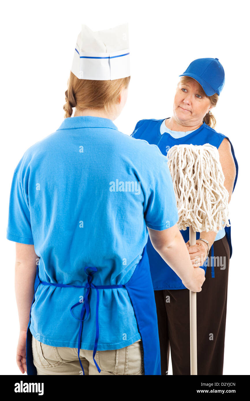 Teenage worker getting handed the mop by her store manager. Isolated on ...