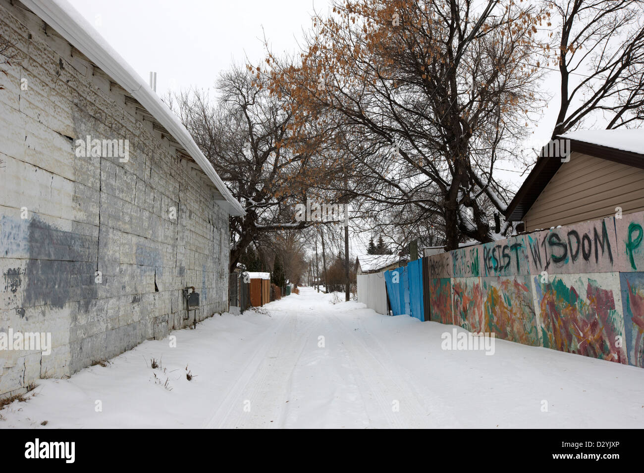 snow covered rear alleyway between houses in Saskatoon Saskatchewan ...
