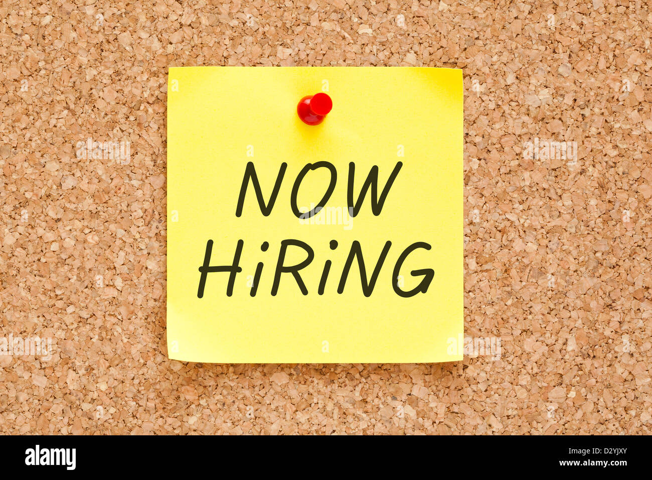 Now Hiring written on an yellow sticky note pinned with red push pin on ...