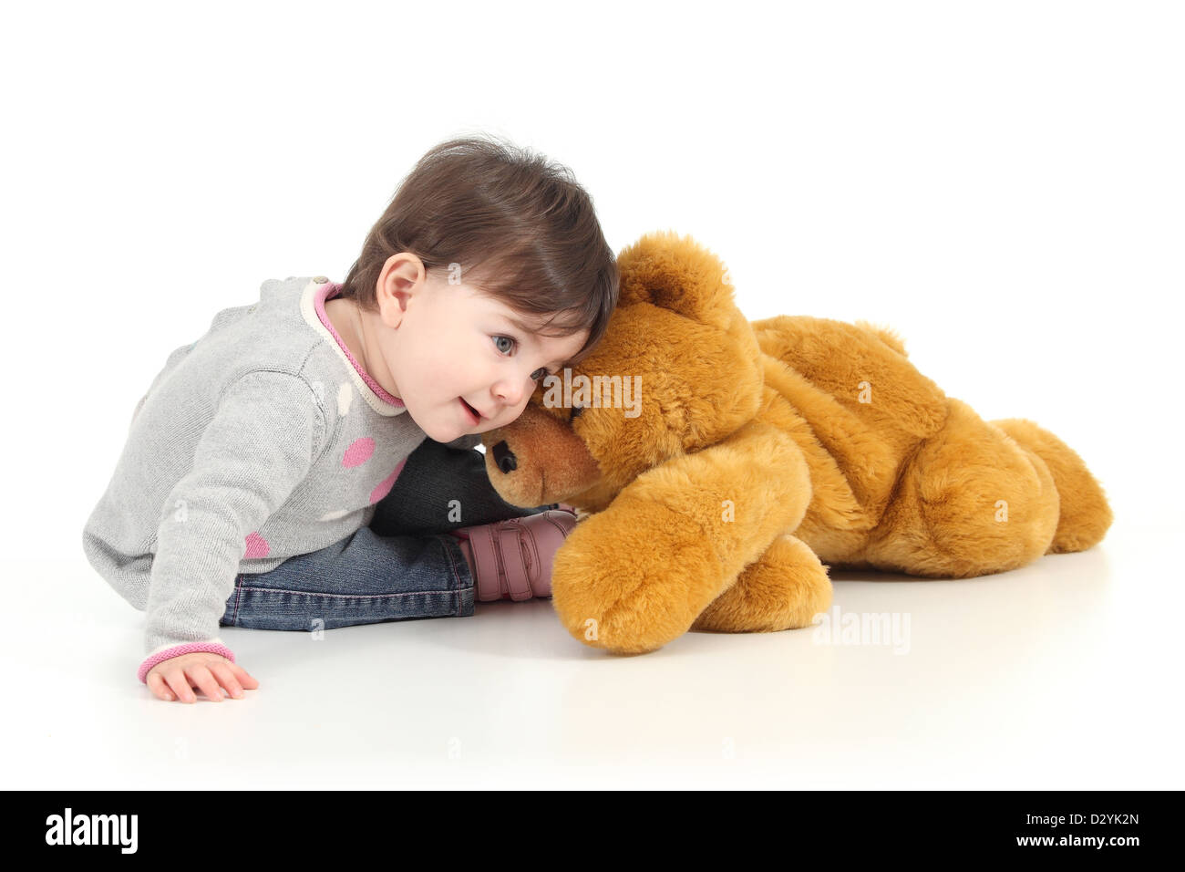 Baby playing with a teddy bear on a white isolated background Stock ...