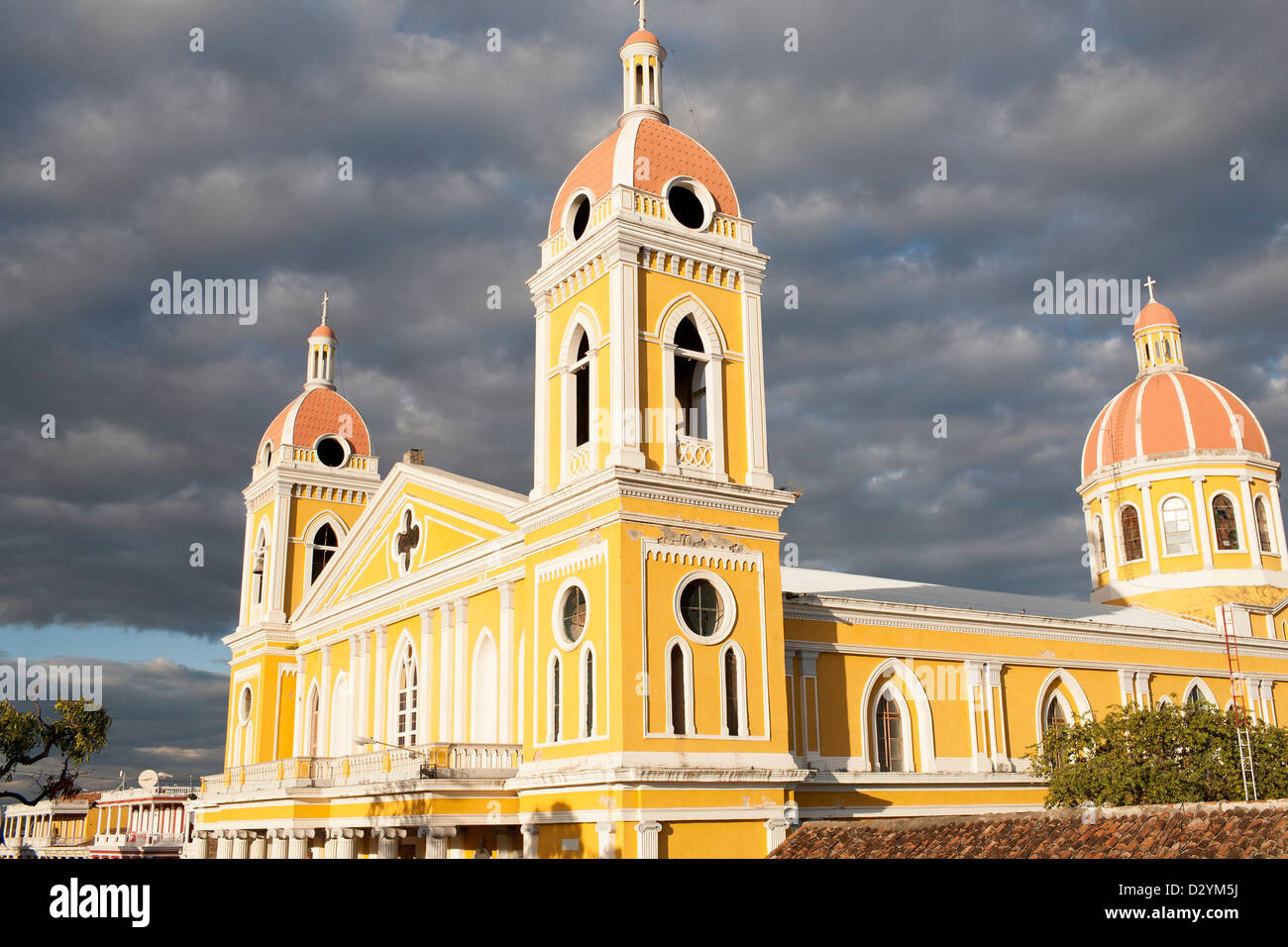 A view of the yellow facade of the colonial cathedral in the plaza of ...