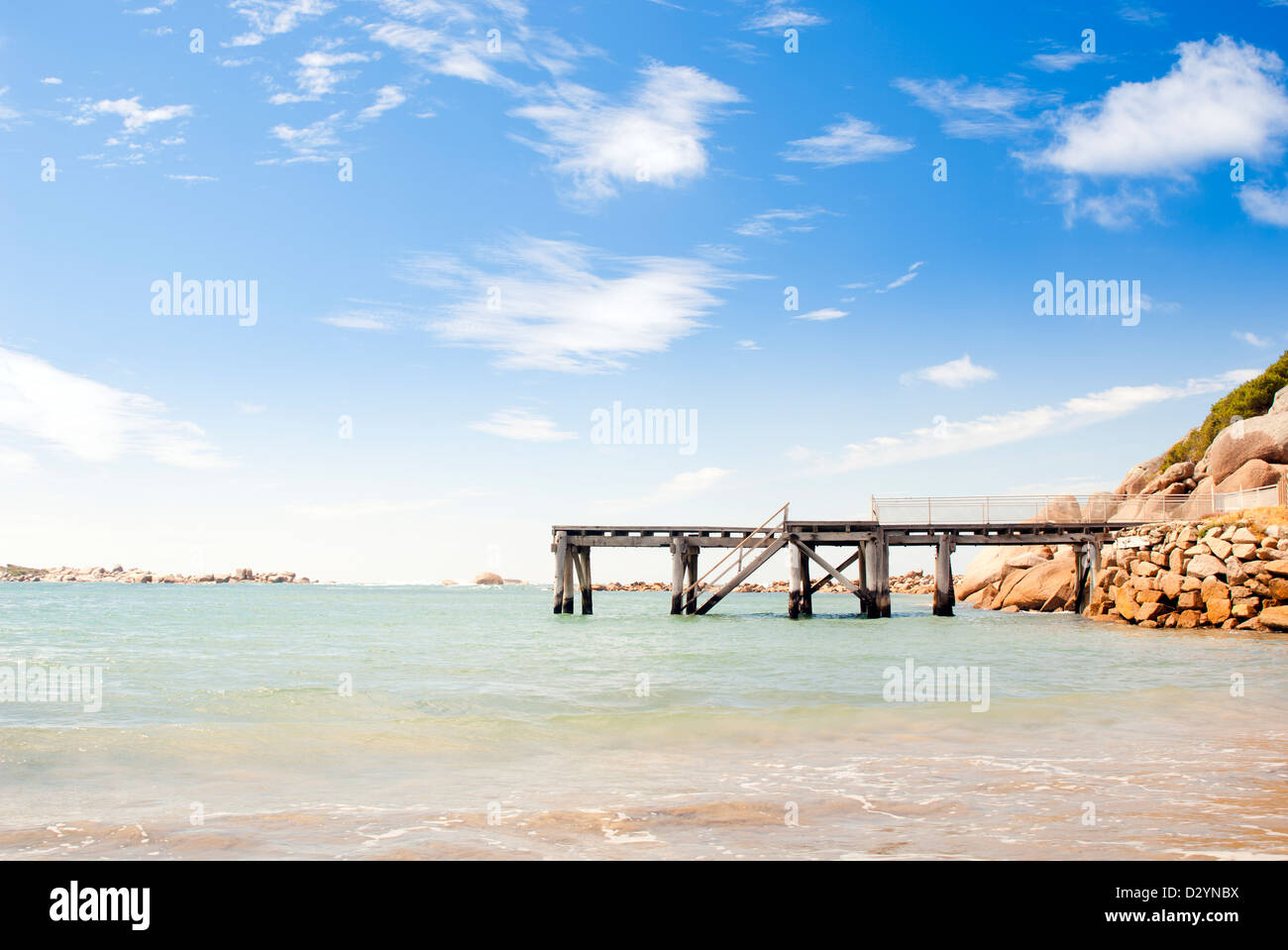 Jetty stretches out into the clear blue water in South Australia Stock ...