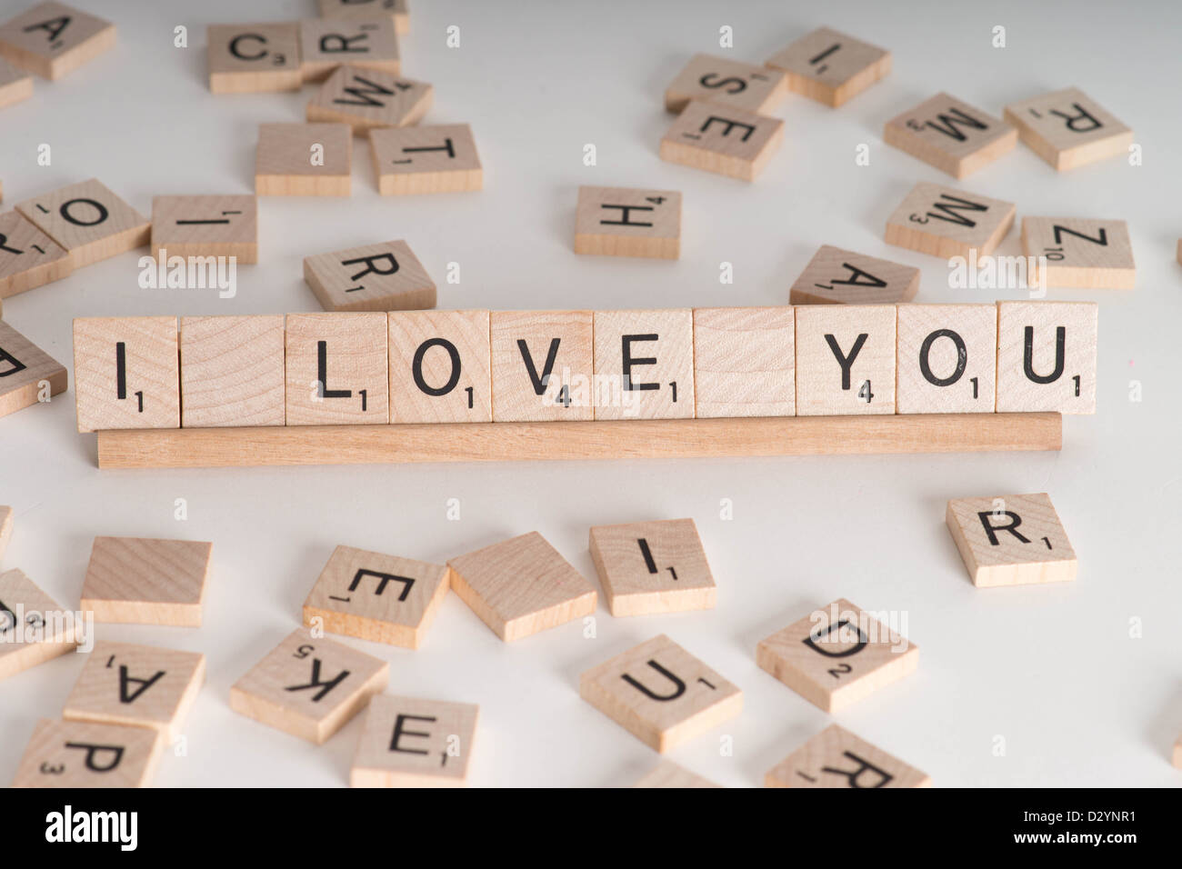 Wooden Scrabble letter spelling out phrase "I Love You". Isolated on ...