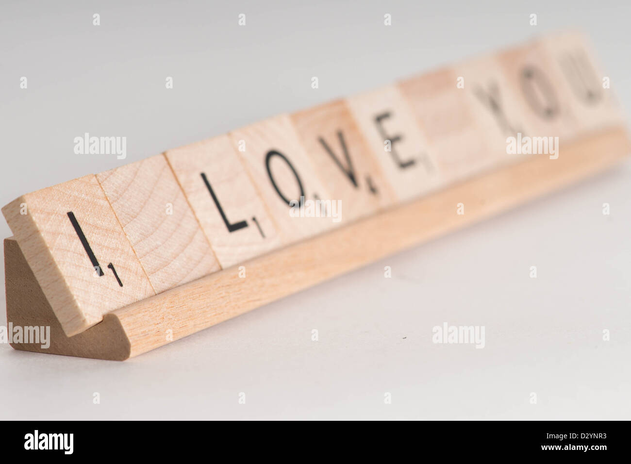 Wooden Scrabble letter spelling out phrase "I Love You". Isolated on ...