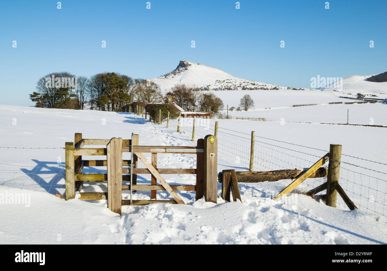 Footpath gate with snow covered Roseberry Topping in distance. North ...