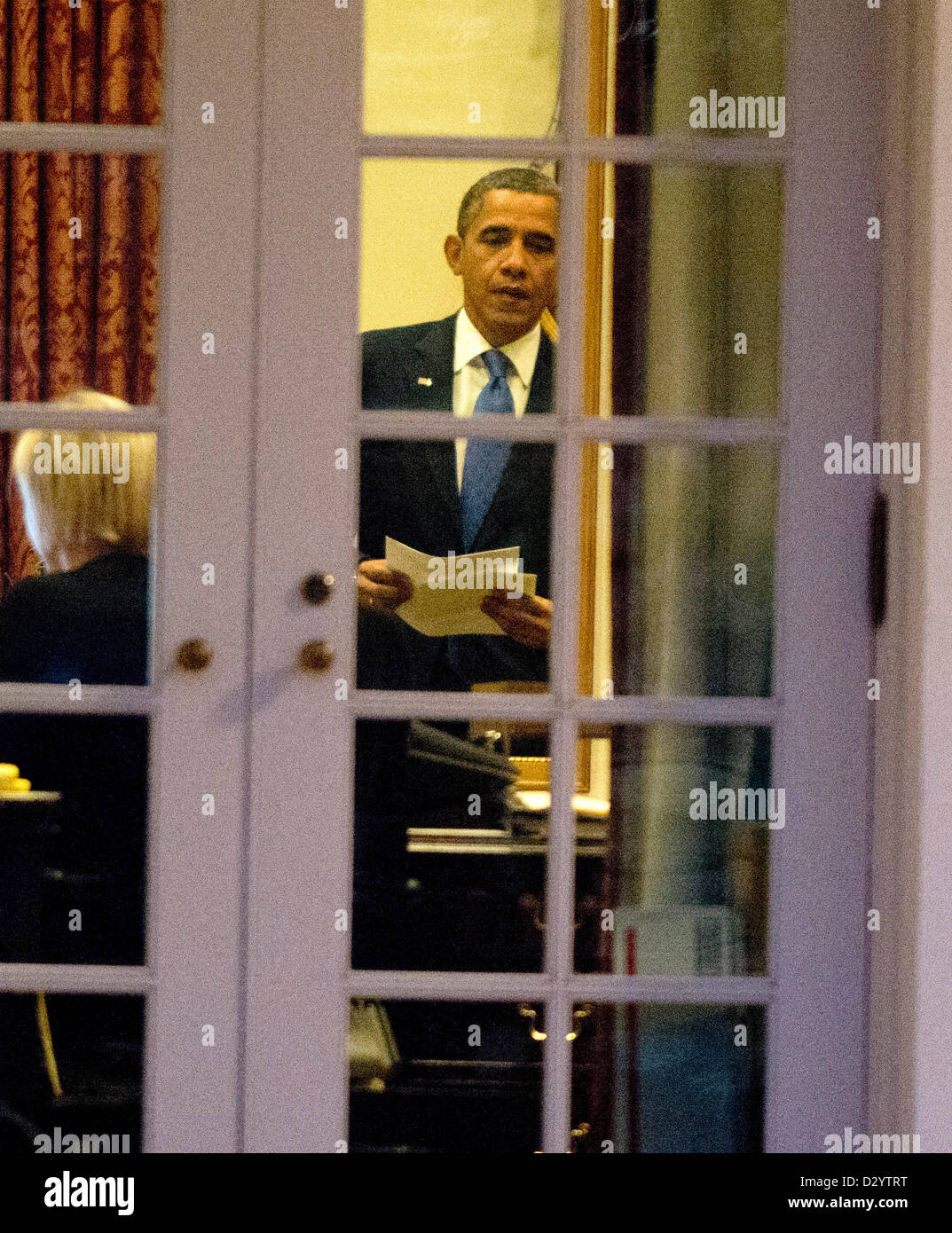 United States President Barack Obama looks over some papers in a West ...