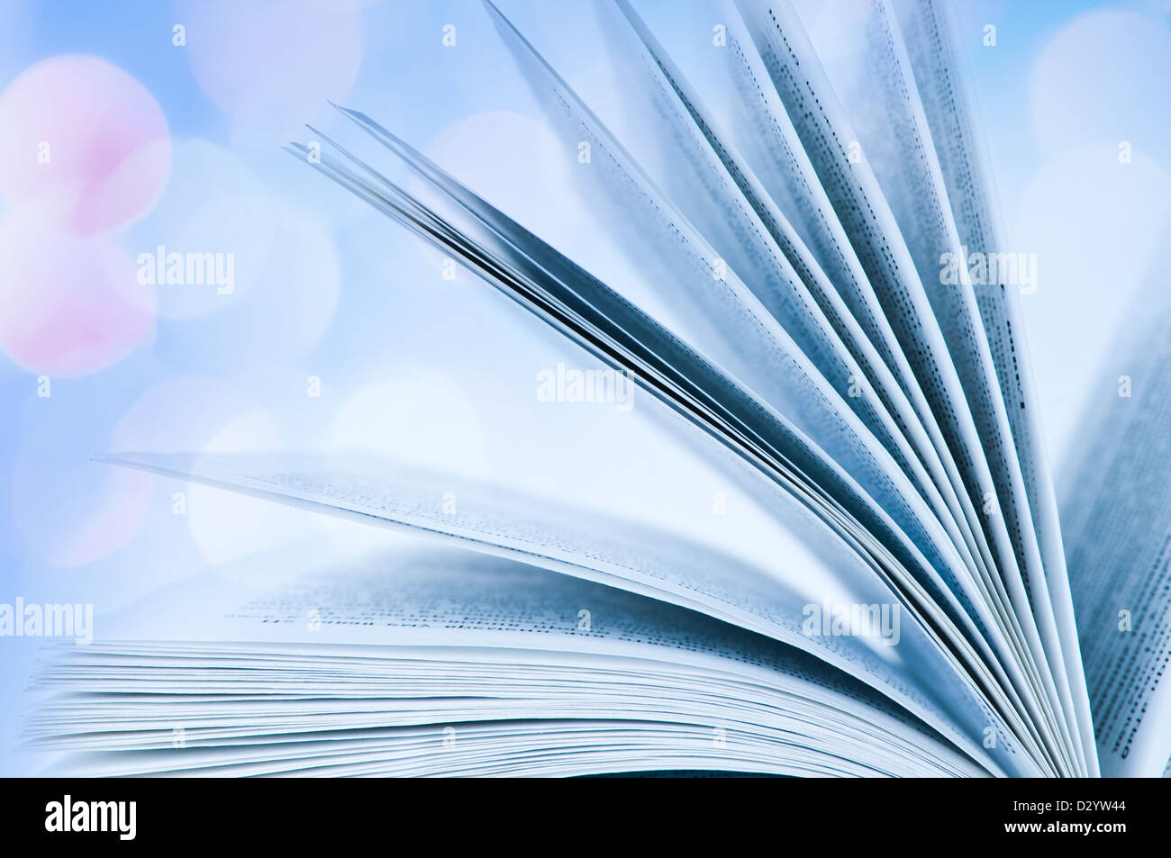 Pages of a book on blue Stock Photo - Alamy