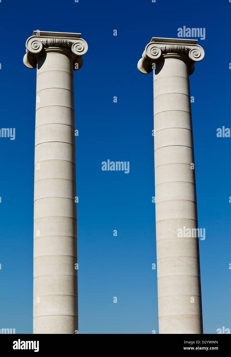 Two massive columns, blue sky Stock Photo - Alamy