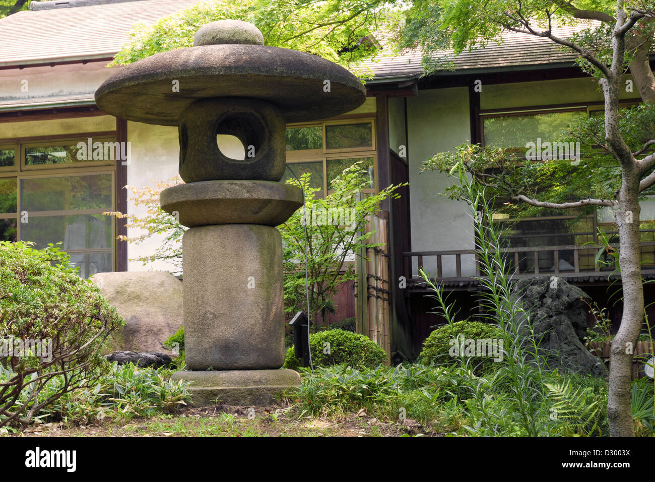big stone lantern in Japanese zen garden by summer time Stock Photo - Alamy