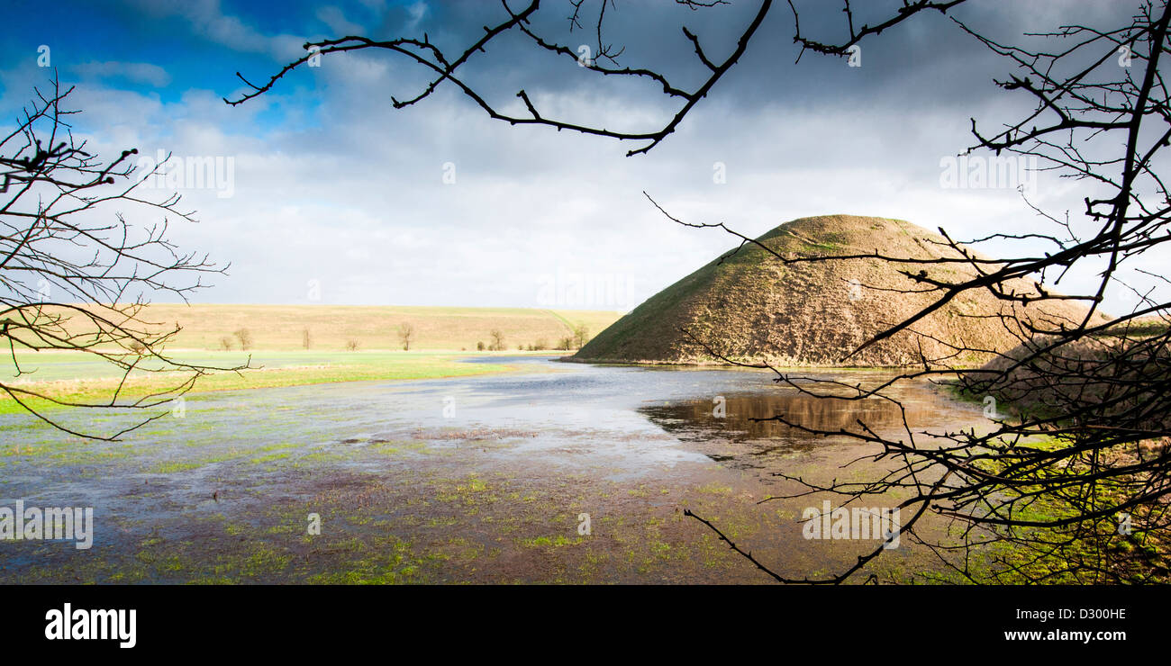 Neolithic Silbury Hill, surrounded by flood water, near Avebury ...