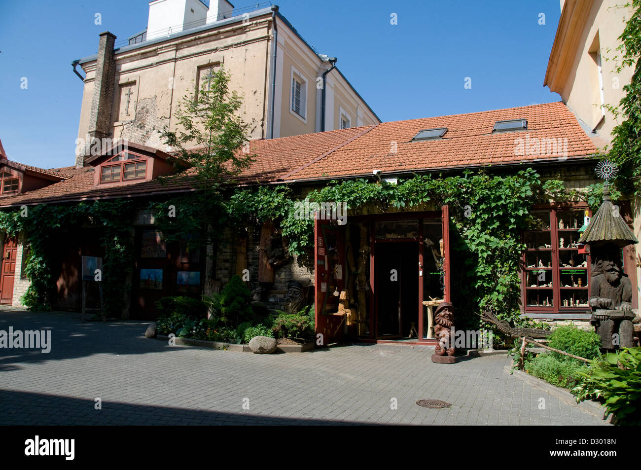 A courtyard of small shops in the old town of Vilnius, Lithuania Stock ...