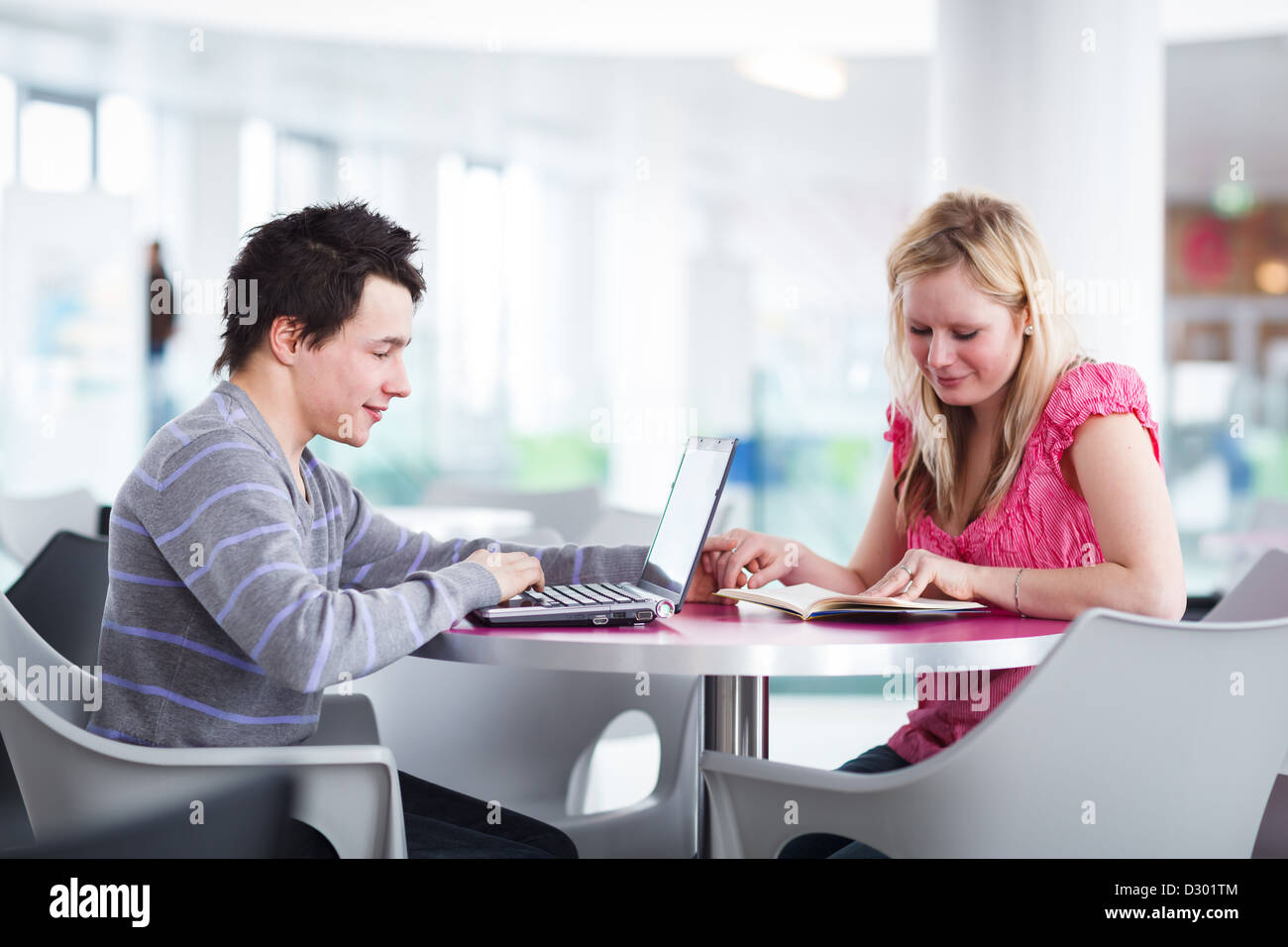 Two college students having fun studying together Stock Photo - Alamy