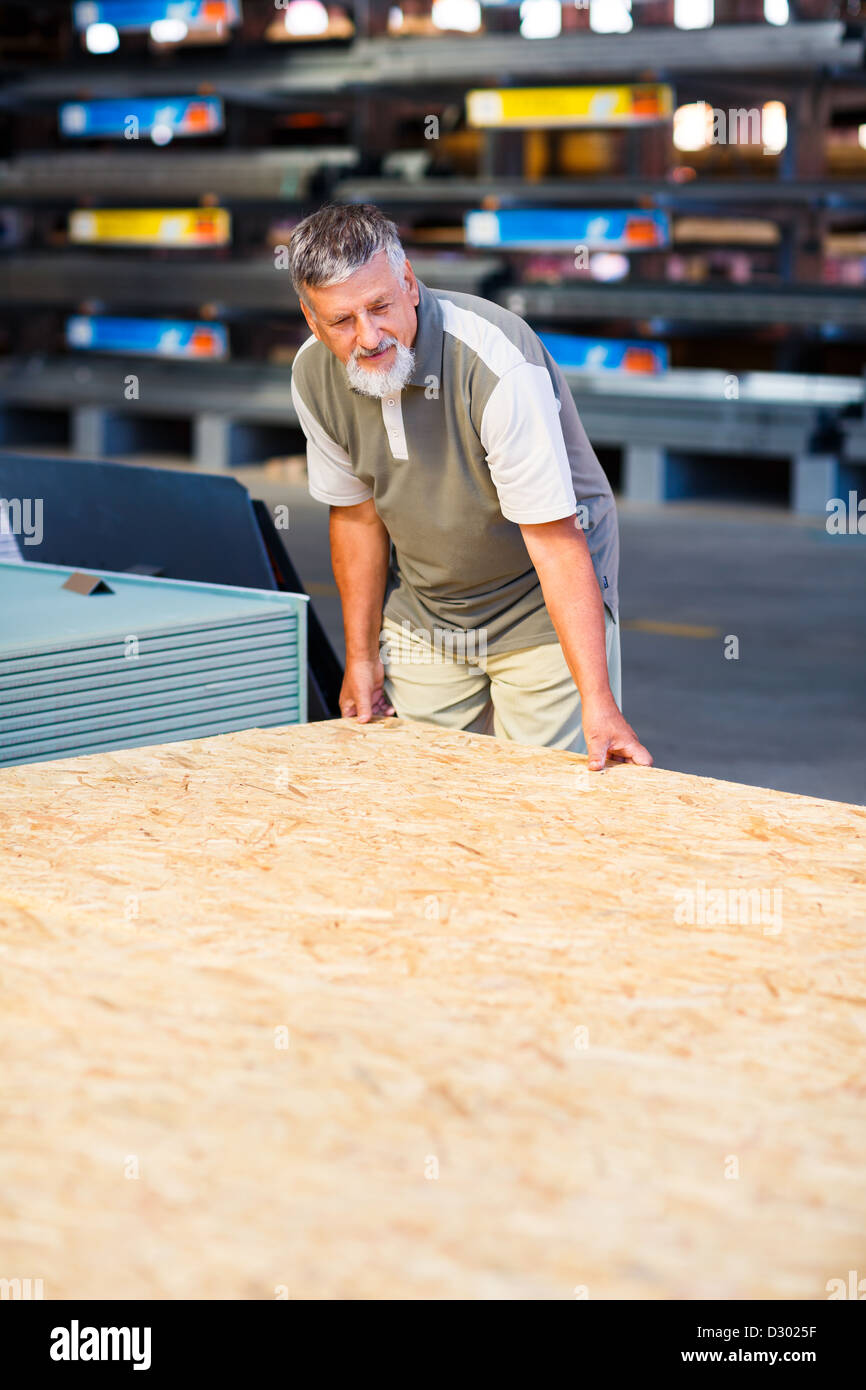 Man buying construction wood in a DIY store Stock Photo - Alamy