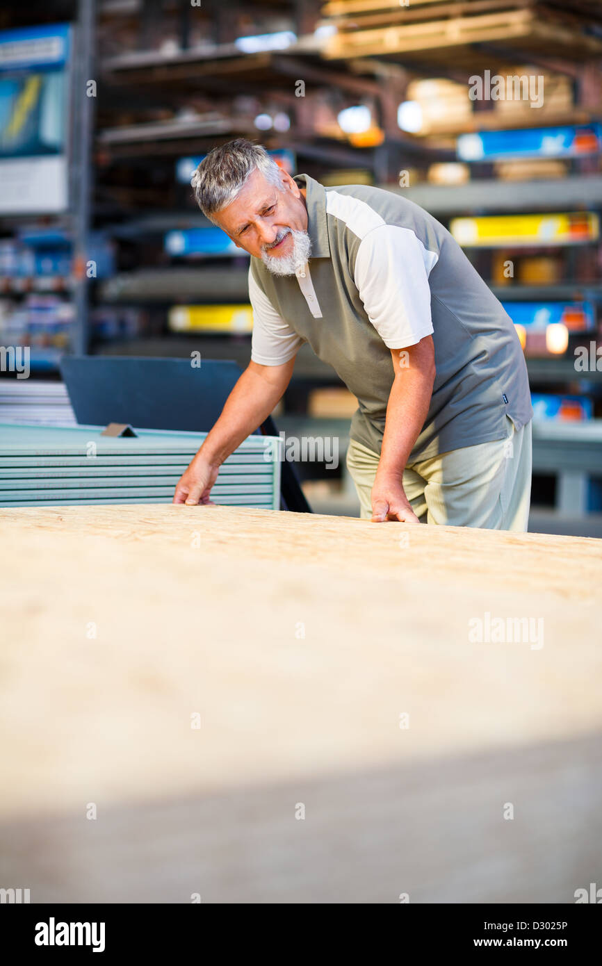 Man buying construction wood in a DIY store Stock Photo - Alamy
