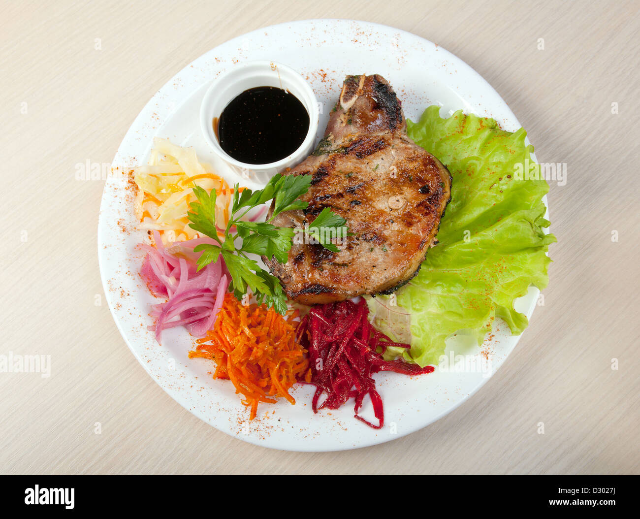 grilled t-bone pork steak and vegetables Stock Photo - Alamy