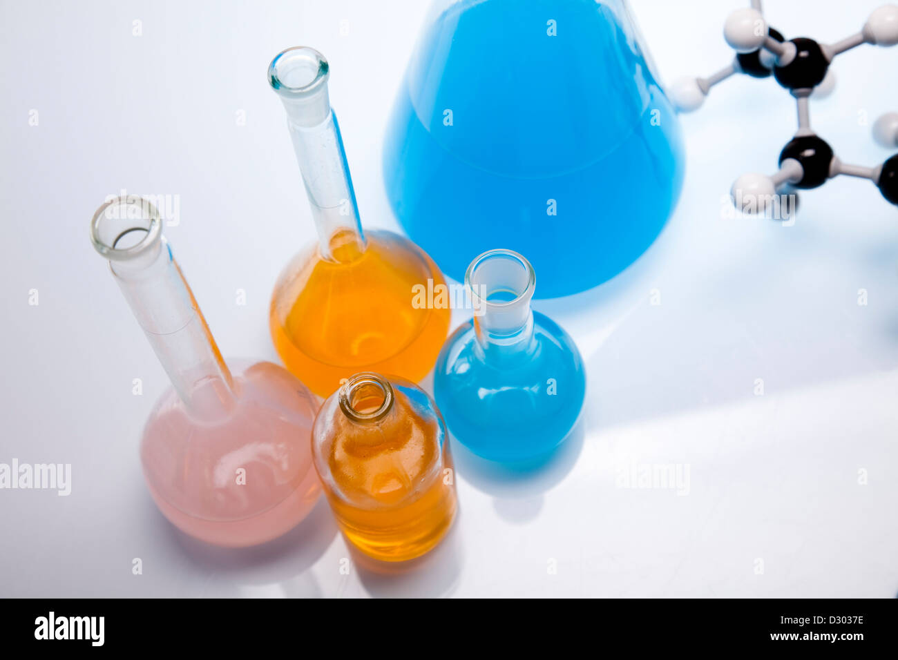 Molecular model and flasks in laboratory Stock Photo - Alamy