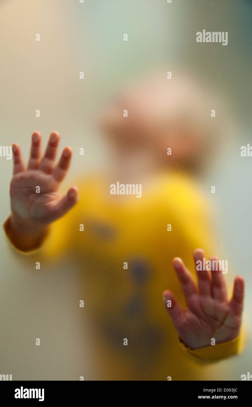 Silhouette of child behind the glass Stock Photo - Alamy