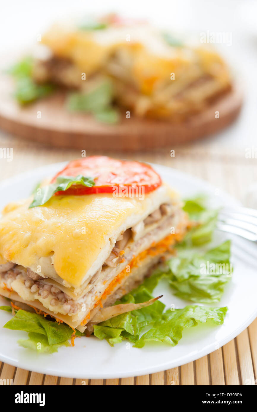vegetable lasagna on lettuce leaf, vertical composition Stock Photo - Alamy