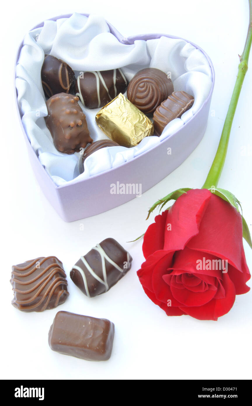 Red rose and box of chocolates Stock Photo - Alamy